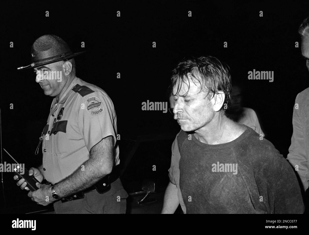 James Earl Ray, his hair in his face, walks back into Brushy Mountain ...