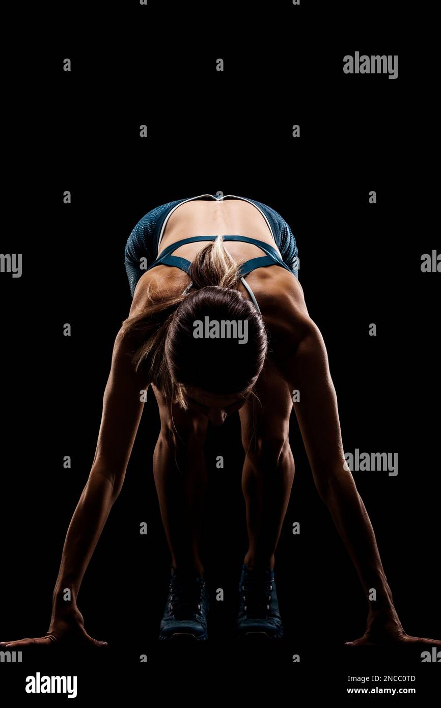 Female runner silhouette in high race start position. Girl in ...