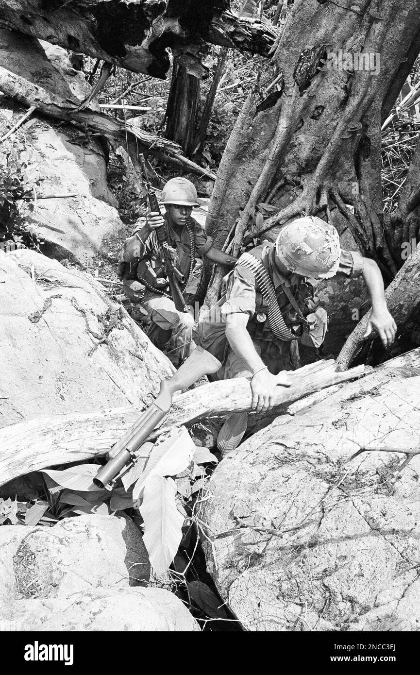 A small patrol of U.S. cavalry troops moves cautiously through dense ...