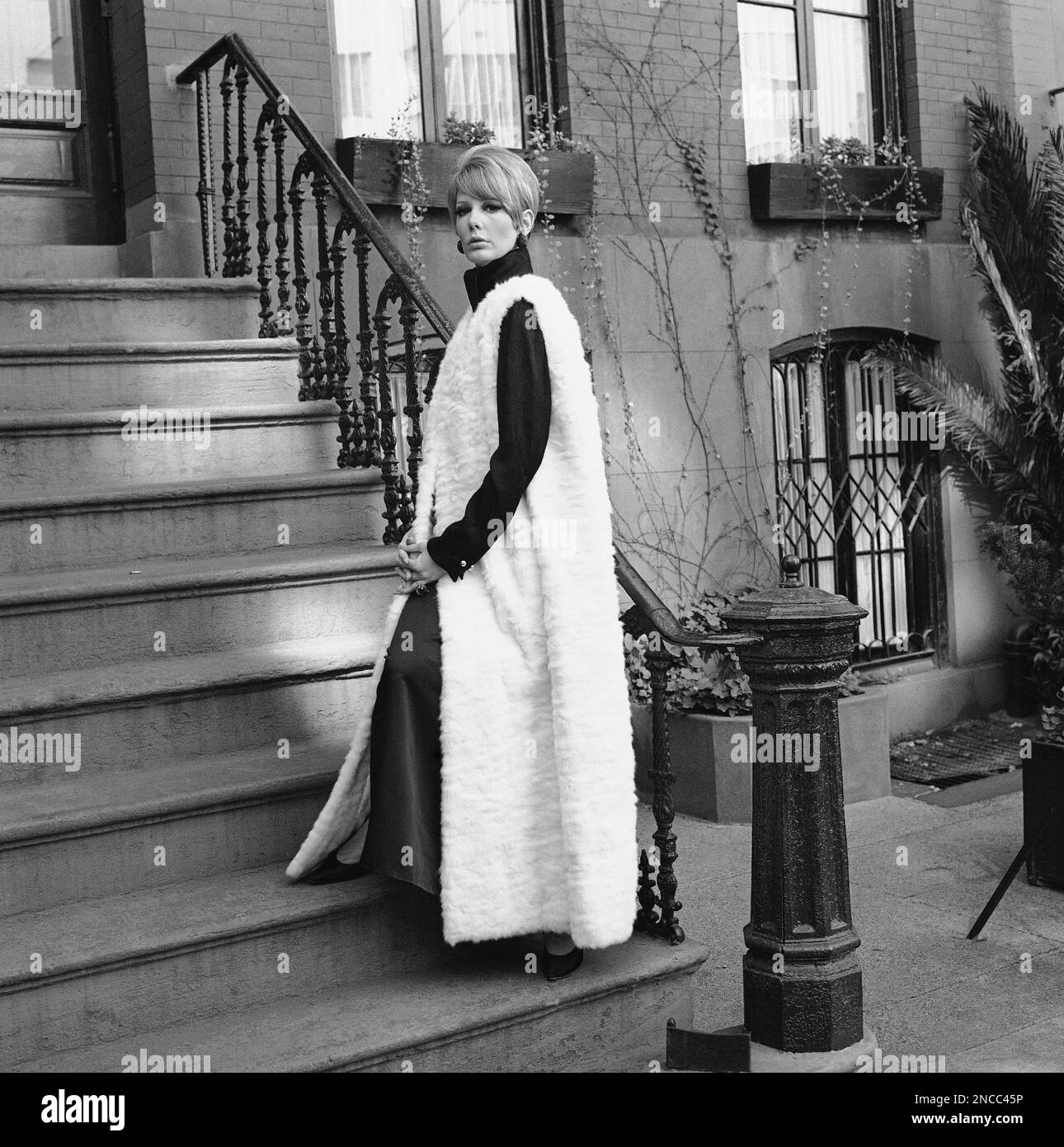 A sleeveless opera cloak of bleached Russian squirrel is worn by Joan Thornton Booker in New ...