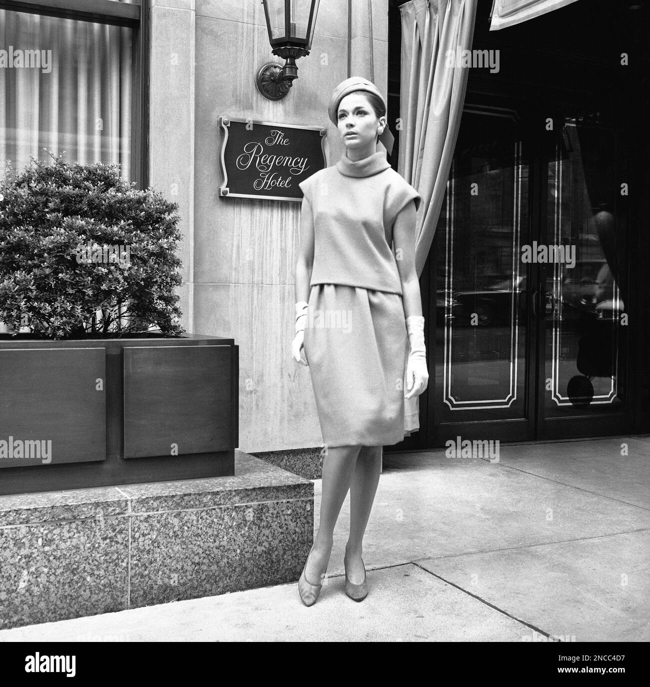 Designer Donald Brooks of Townley fashion house created this apricot ...