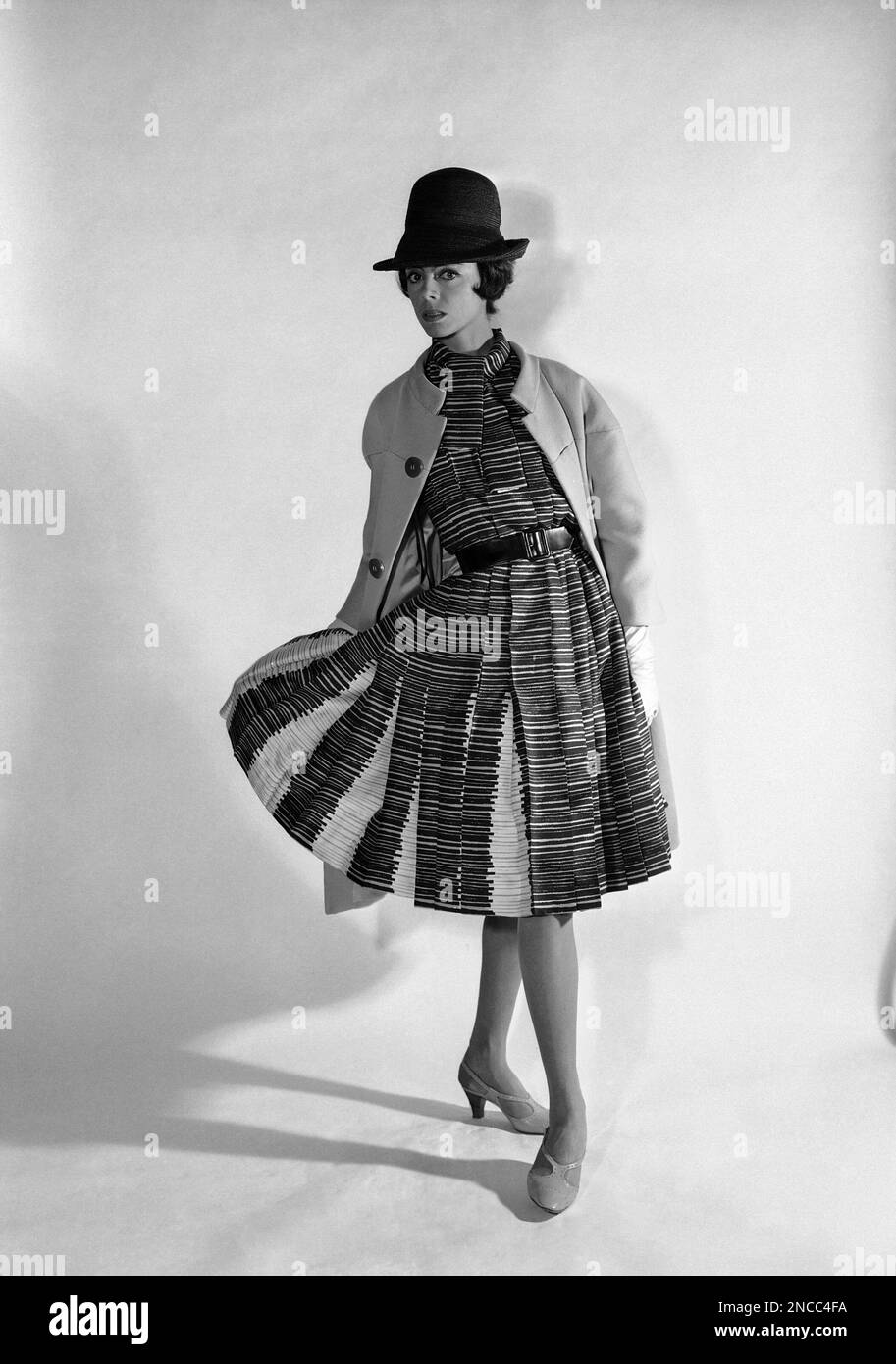 The pleated skirt, a mark of spring, takes on added movement by the ...