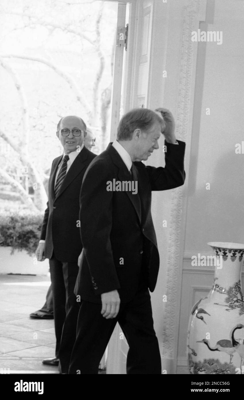 President Jimmy Carter, right, enters the Oval Office in Washington Feb ...