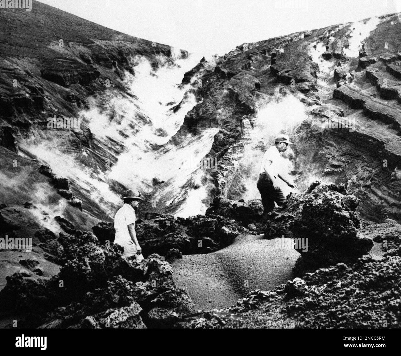 Filipino volcanologists Arturo Alcaraz, left, and Rocelio Datuin ...