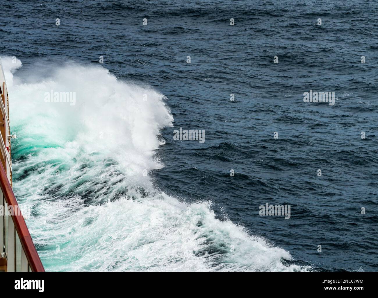 Bow of cruise ship in heavy seas and swell with waves crashing from the ...