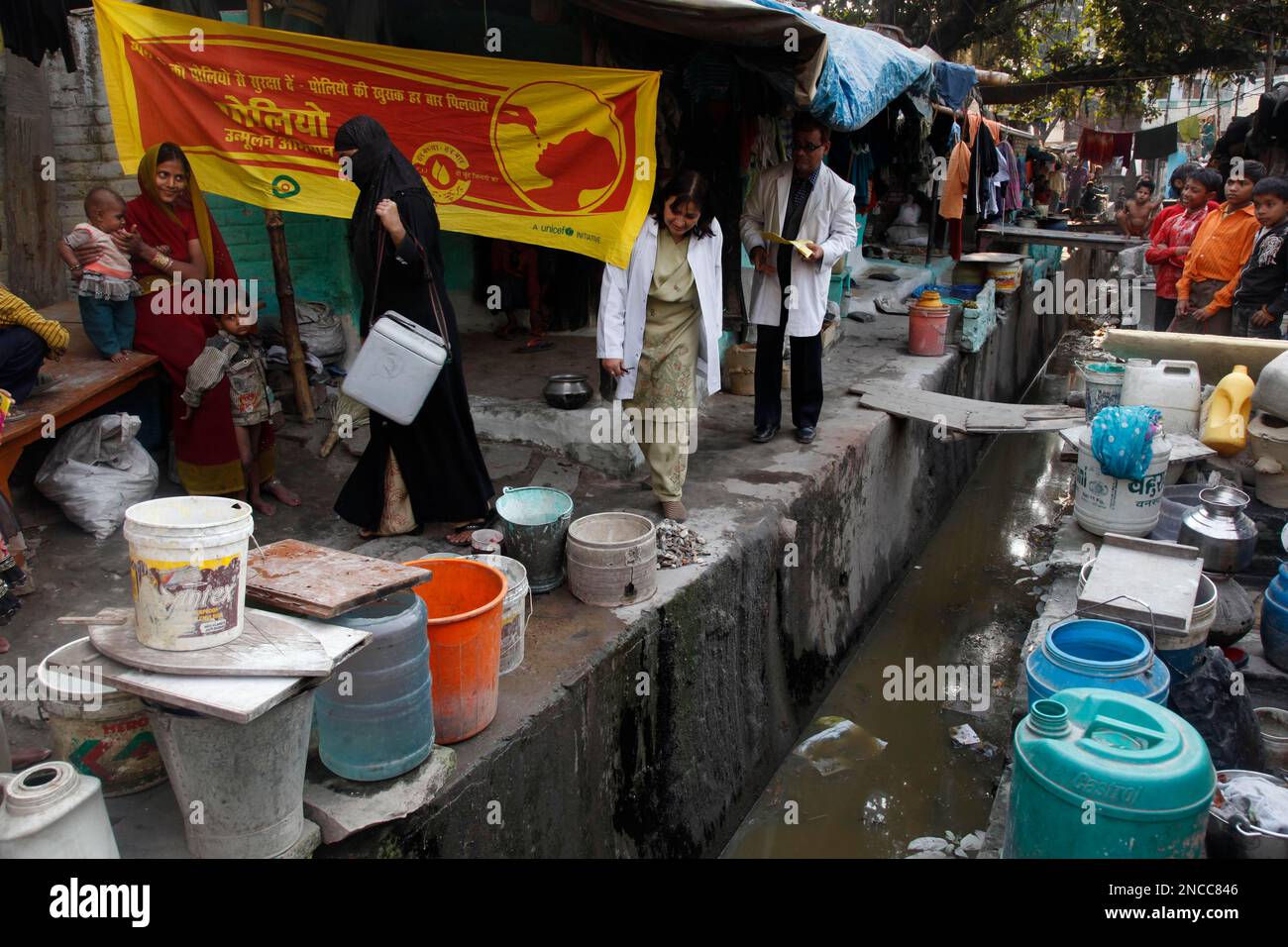 Health workers return after administering polio vaccine drops to ...