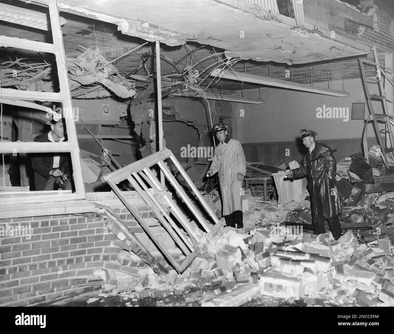 Police examine wreckage of wing of newly desegregated Hattie Cotton ...