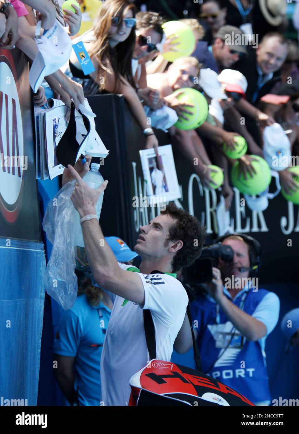 Britain's Andy Murray signs autographs following his fourth round win ...