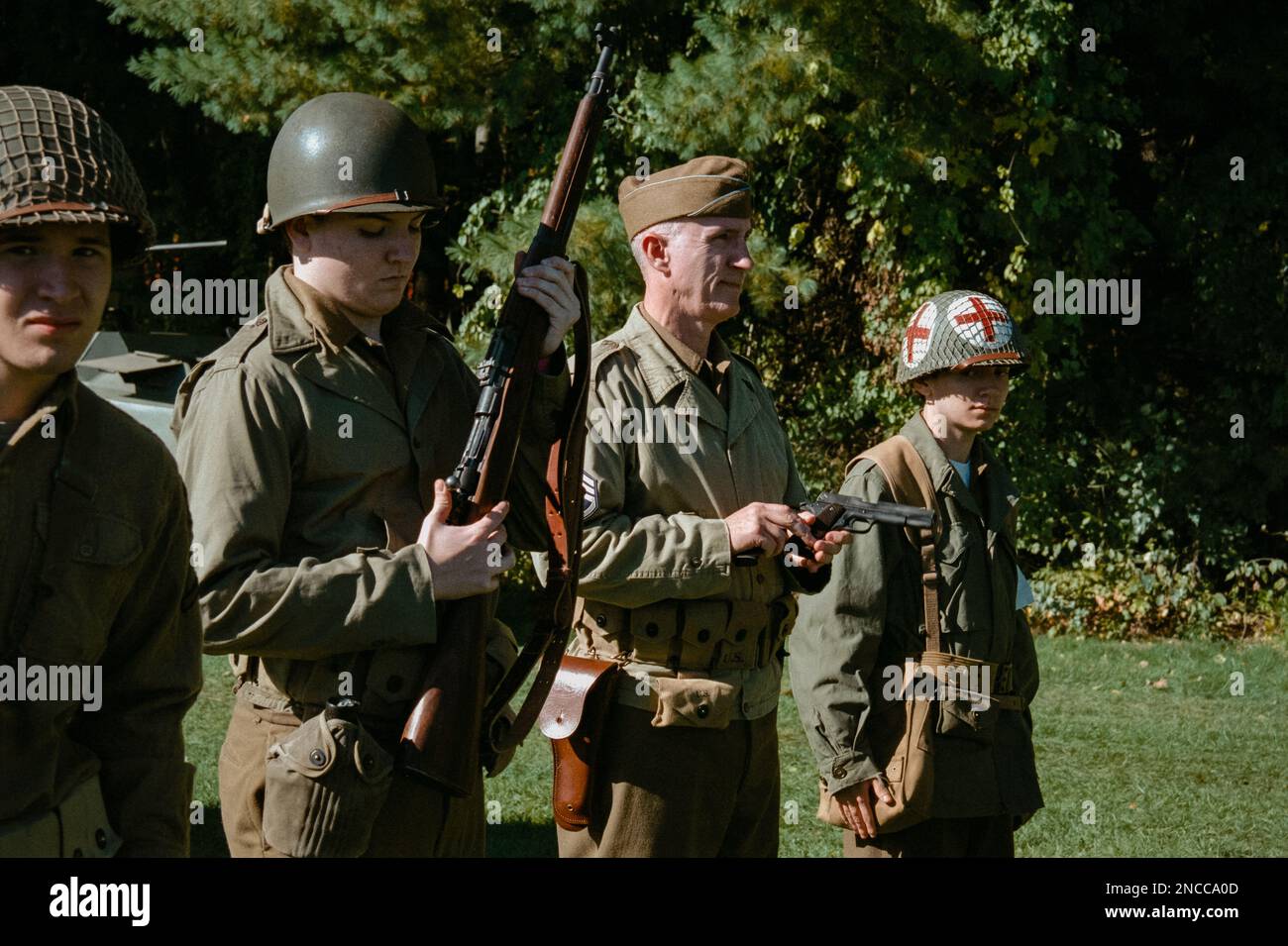 WWII American troops and Red Cross confront the enemy with loaded and ...