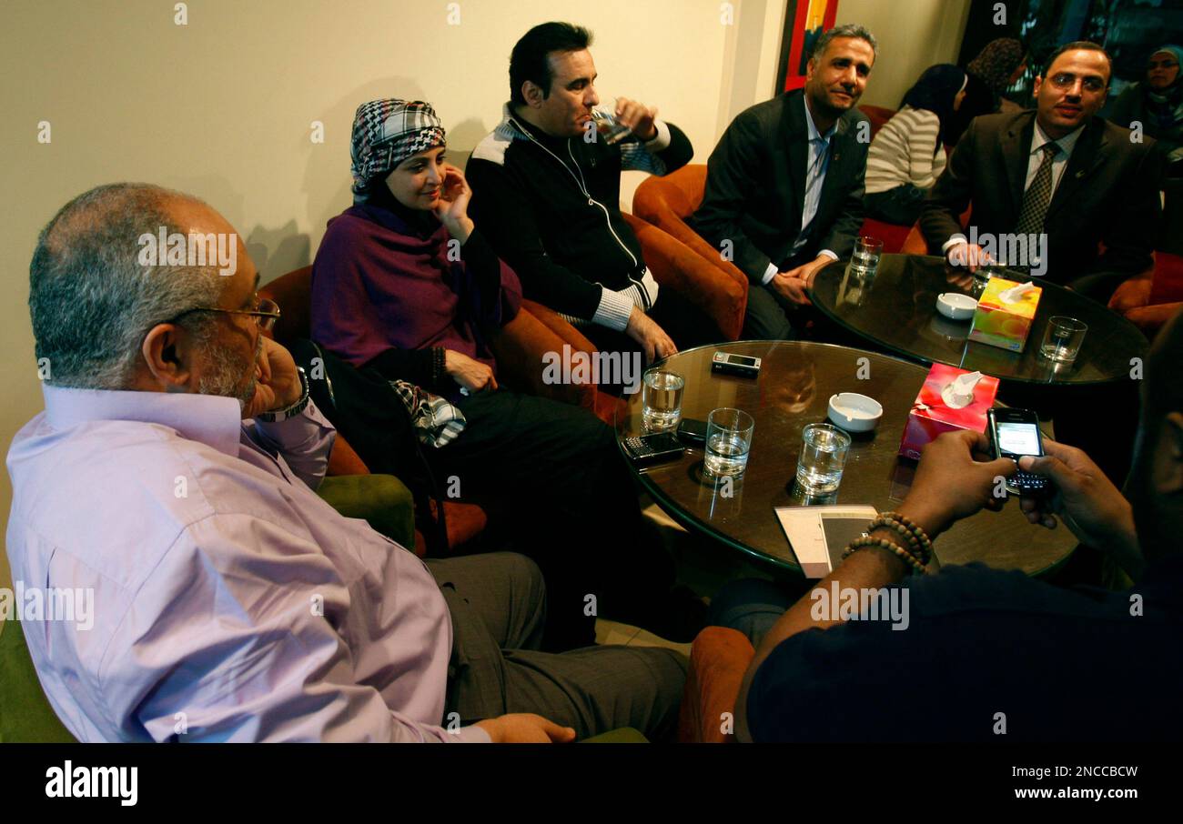 Egyptian actress Hanan Turk, second left, meets with fans in a coffee ...