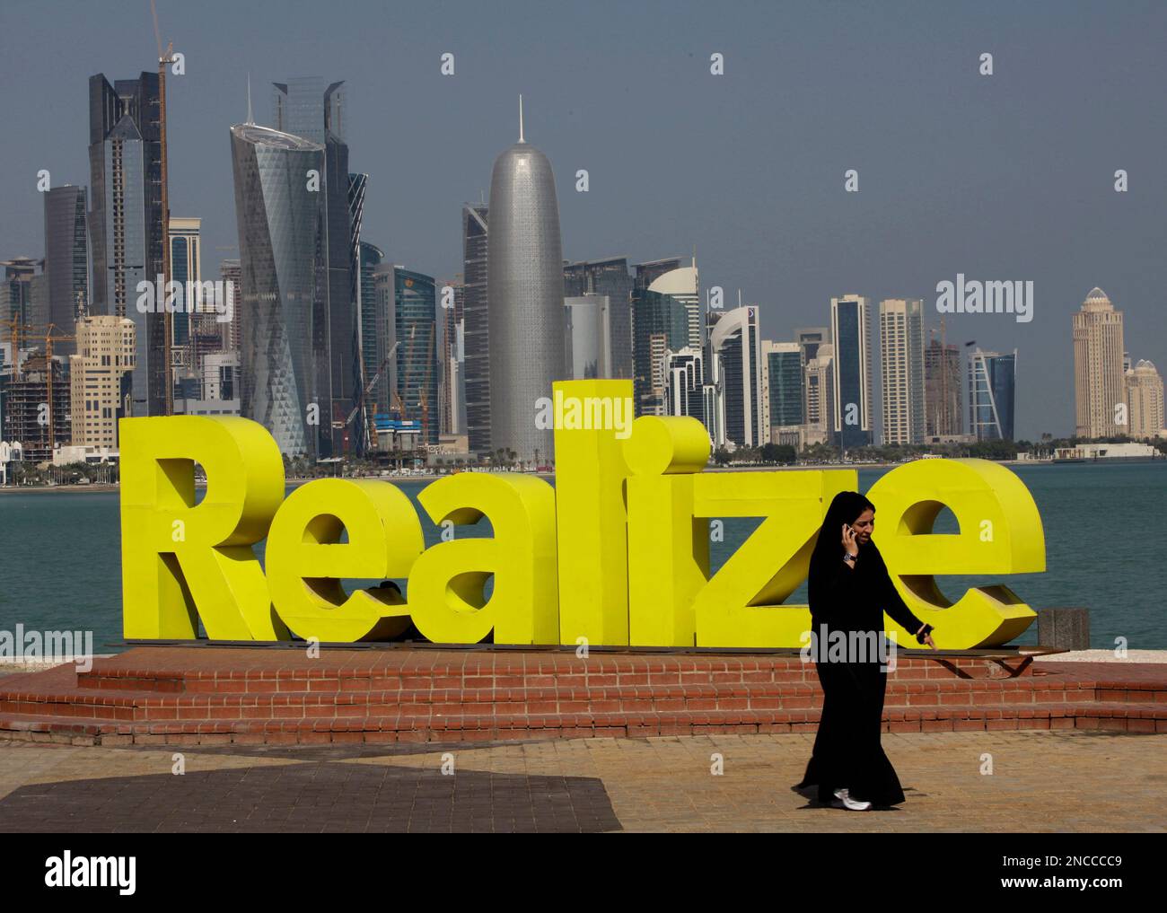 A women walks at the corniche seaside, in Doha, Qatar, on Sunday Jan ...