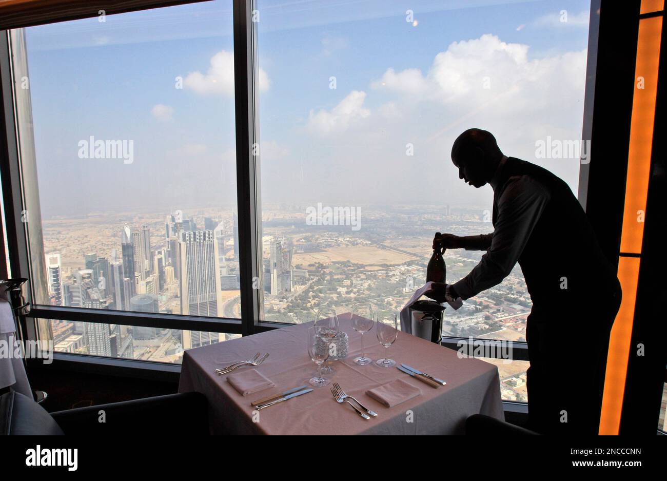 Bar captain, Solomon from Kenya, places a bottle of champagne at "At ...