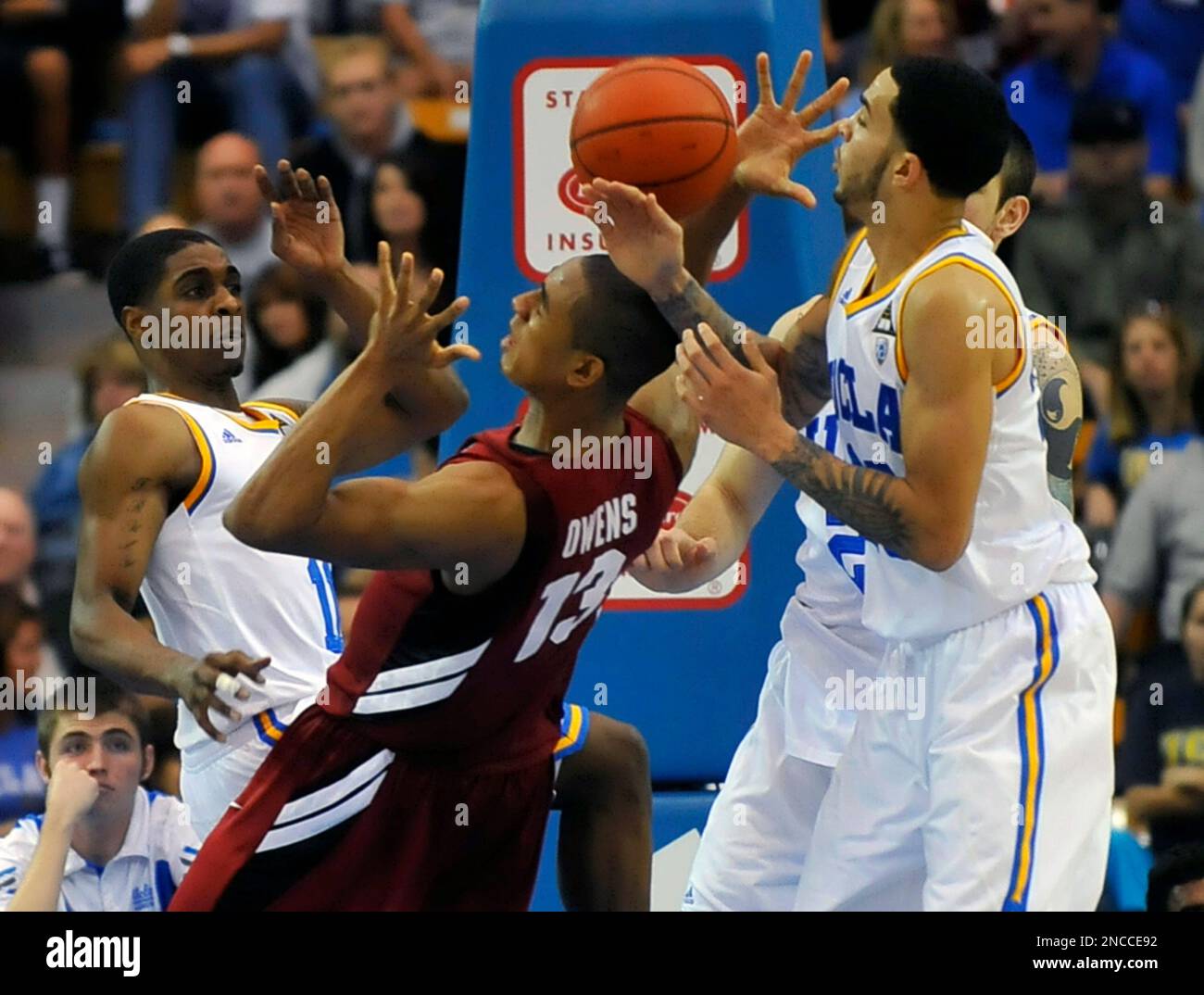 Stanford's Josh Owens (13) fights for a loose ball with UCLA's Lazeric ...