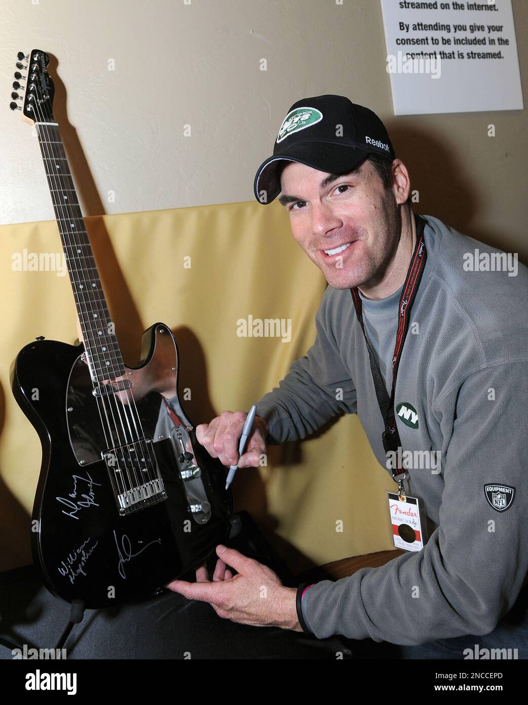 Actor Brandon Molale signs a Fender guitar at the Fender Music Lodge ...