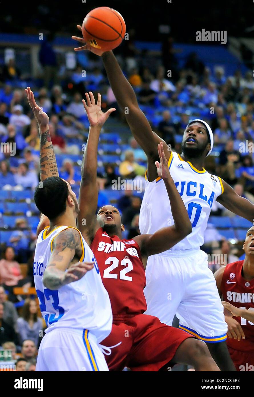 Stanford's Jarrett Mann (22) has his shot blocked as he tries to shoot ...