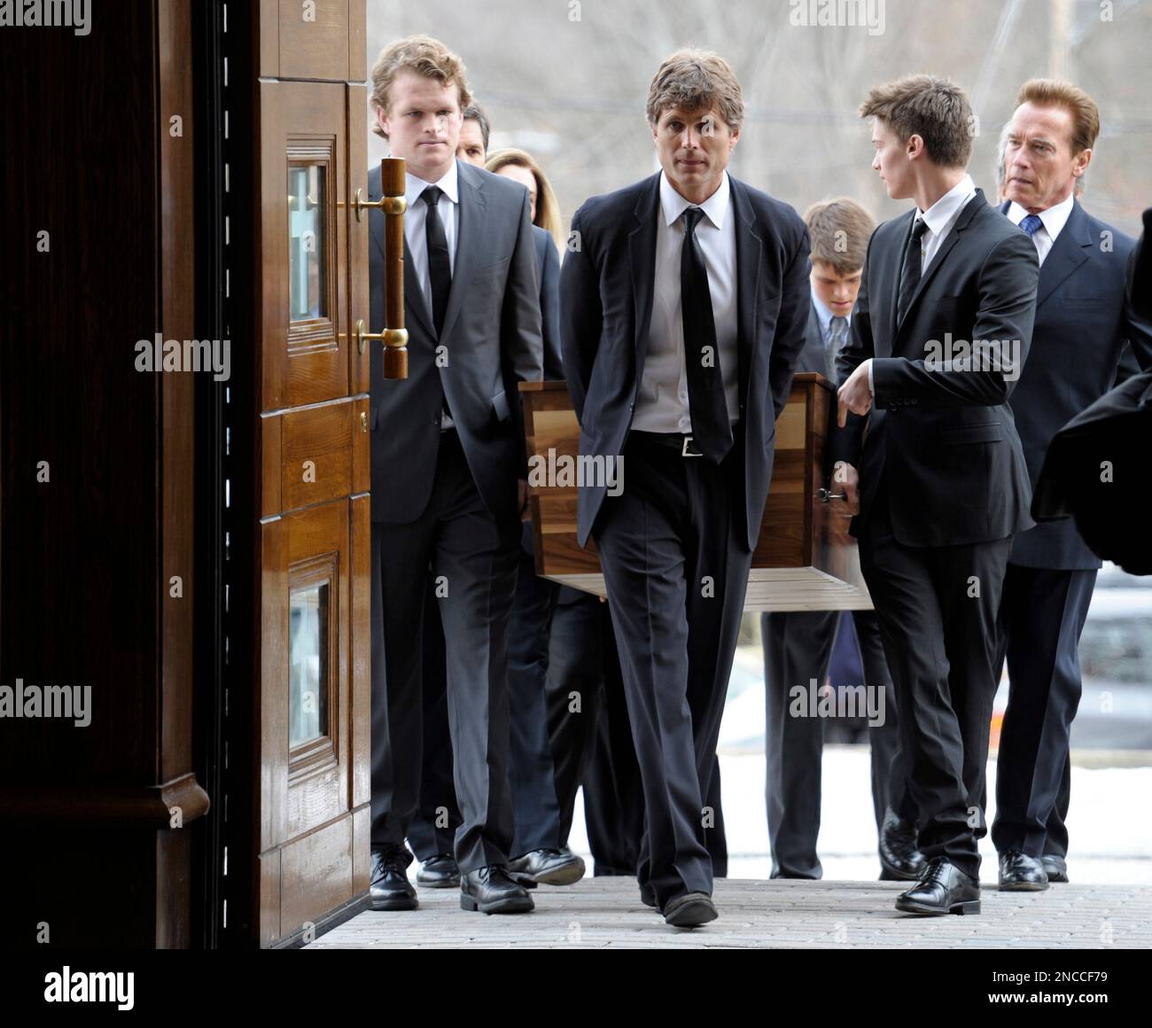 Anthony Shriver leads the pall bearers carrying his father's, R ...