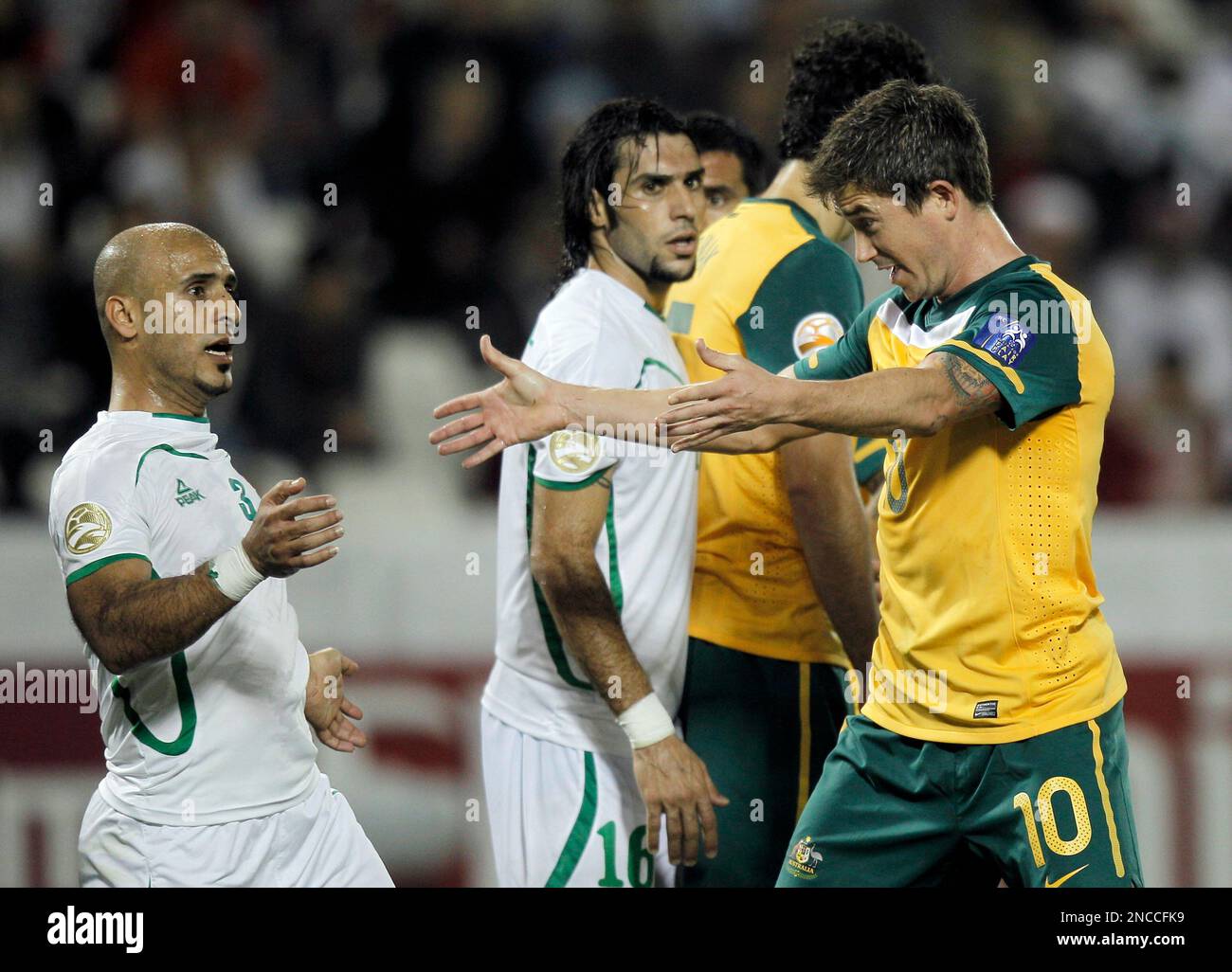 Australia's Harry Kewell, right, reacts with Iraq's Basem Abbas during ...