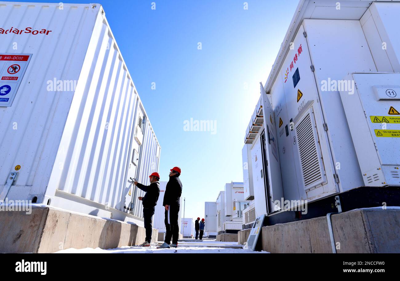 ZHANGYE, CHINA - FEBRUARY 14, 2023 - Workers inspect storage warehouses at the construction site ...