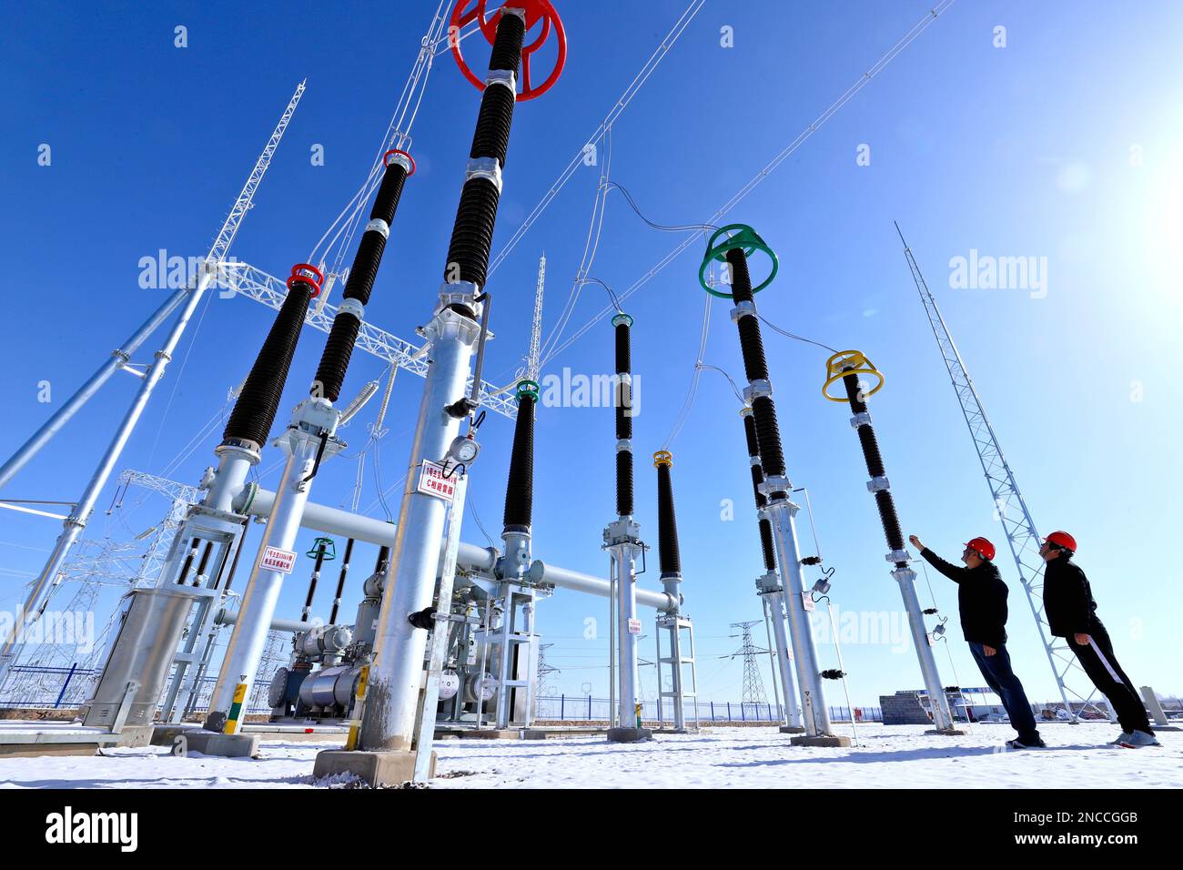 ZHANGYE, CHINA - FEBRUARY 14, 2023 - Workers check the installation of ...
