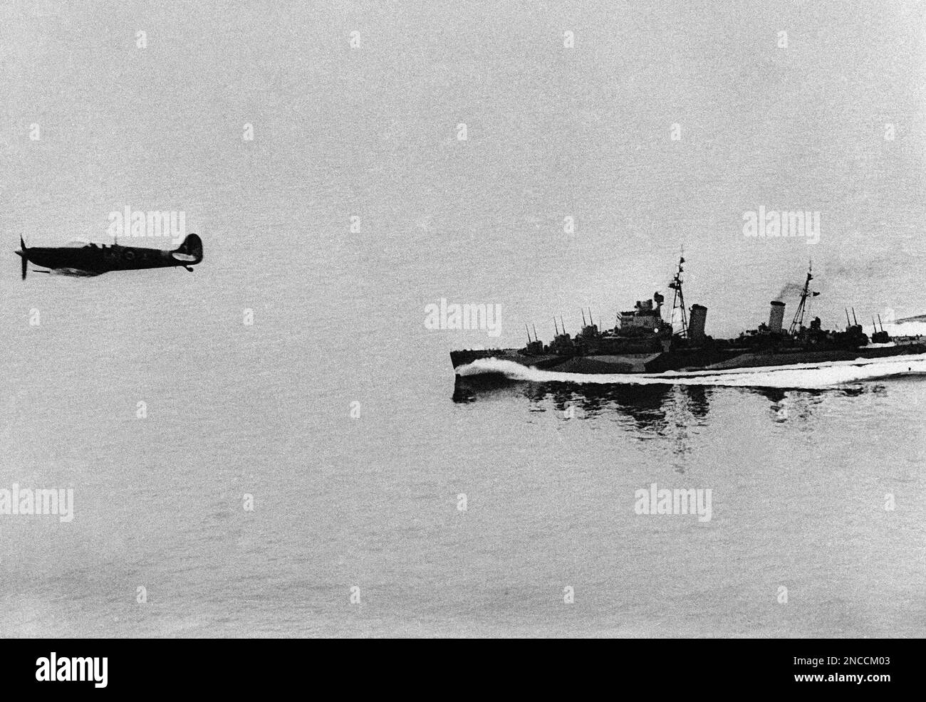 British Dido Class Cruiser, H.M.S. Argonaut, somewhere at sea, escorted ...