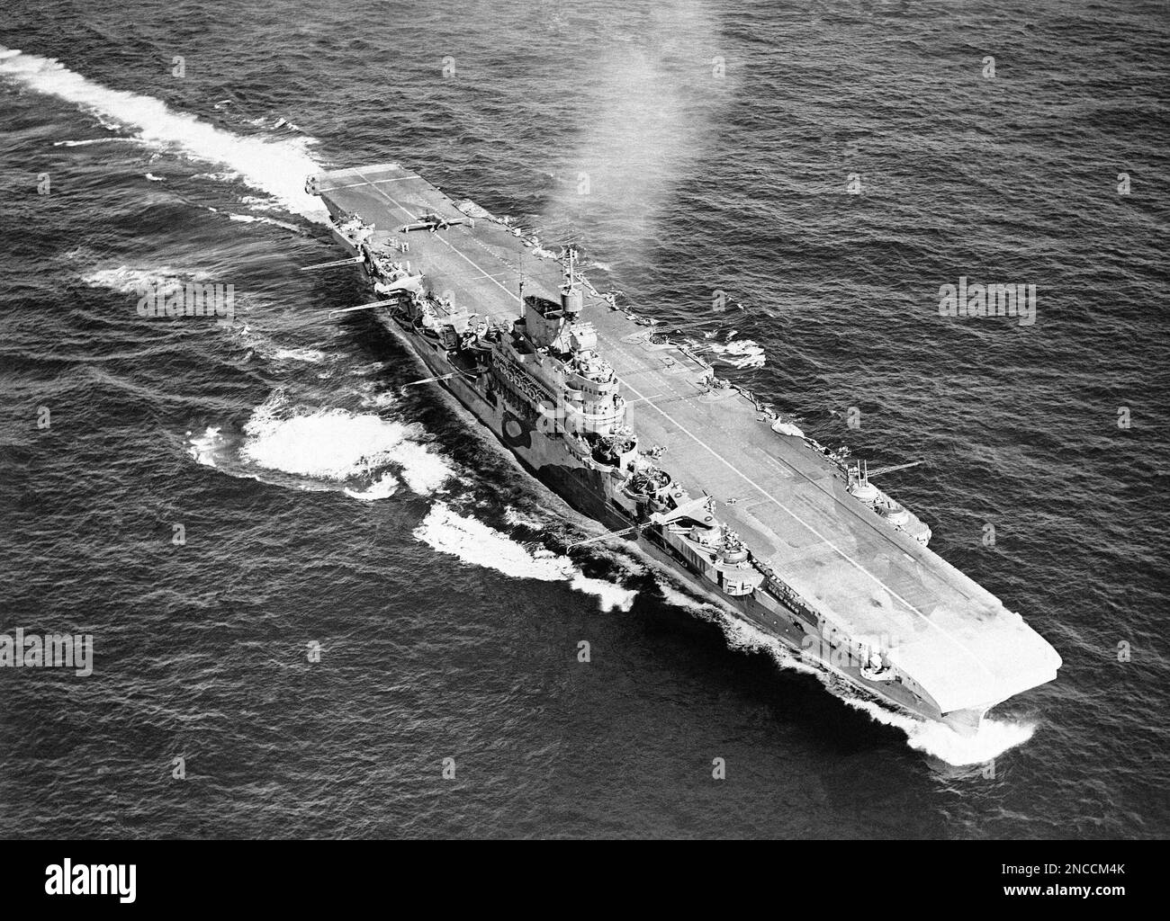 British aircraft carrier, H.M.S. Indomitable, from one of her planes, as she ploughed through ...