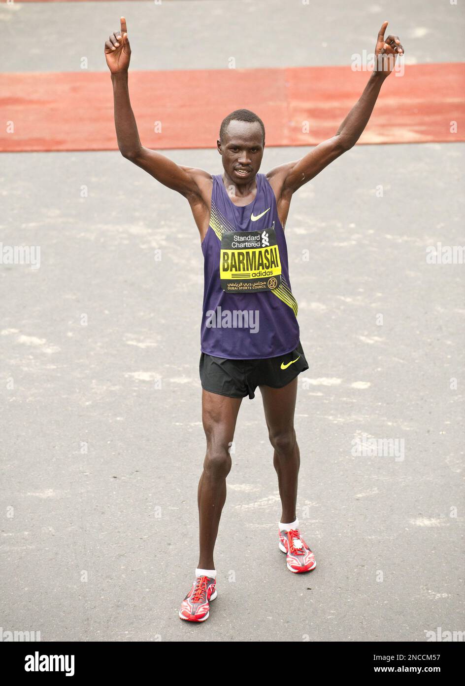 David Barmasai Tumo of Kenya crosses the finish line to win the Dubai ...