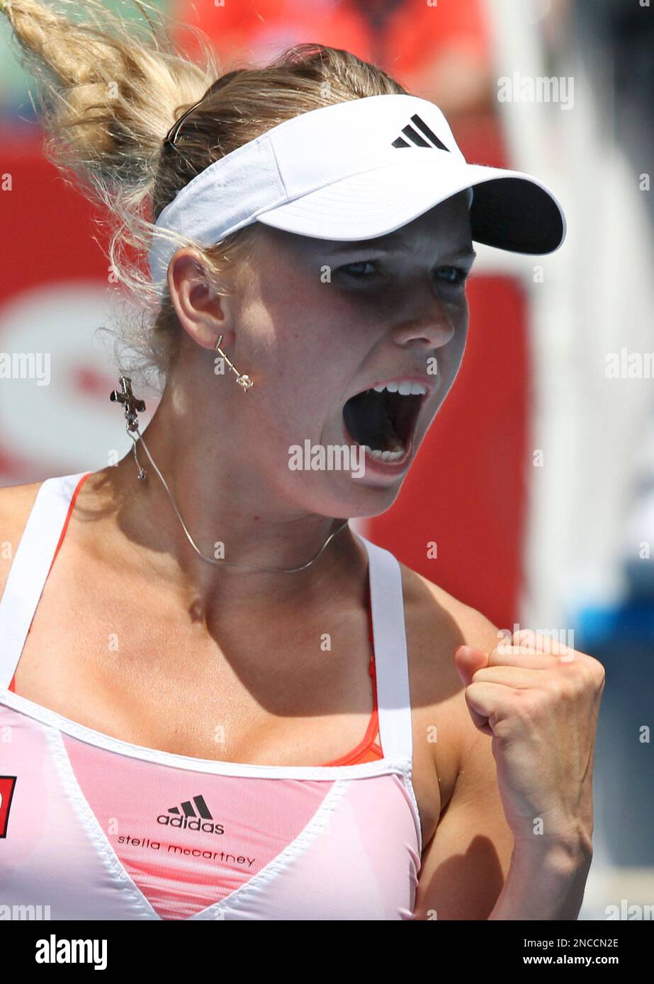Denmark's Caroline Wozniacki yells as she celebrates during her third ...