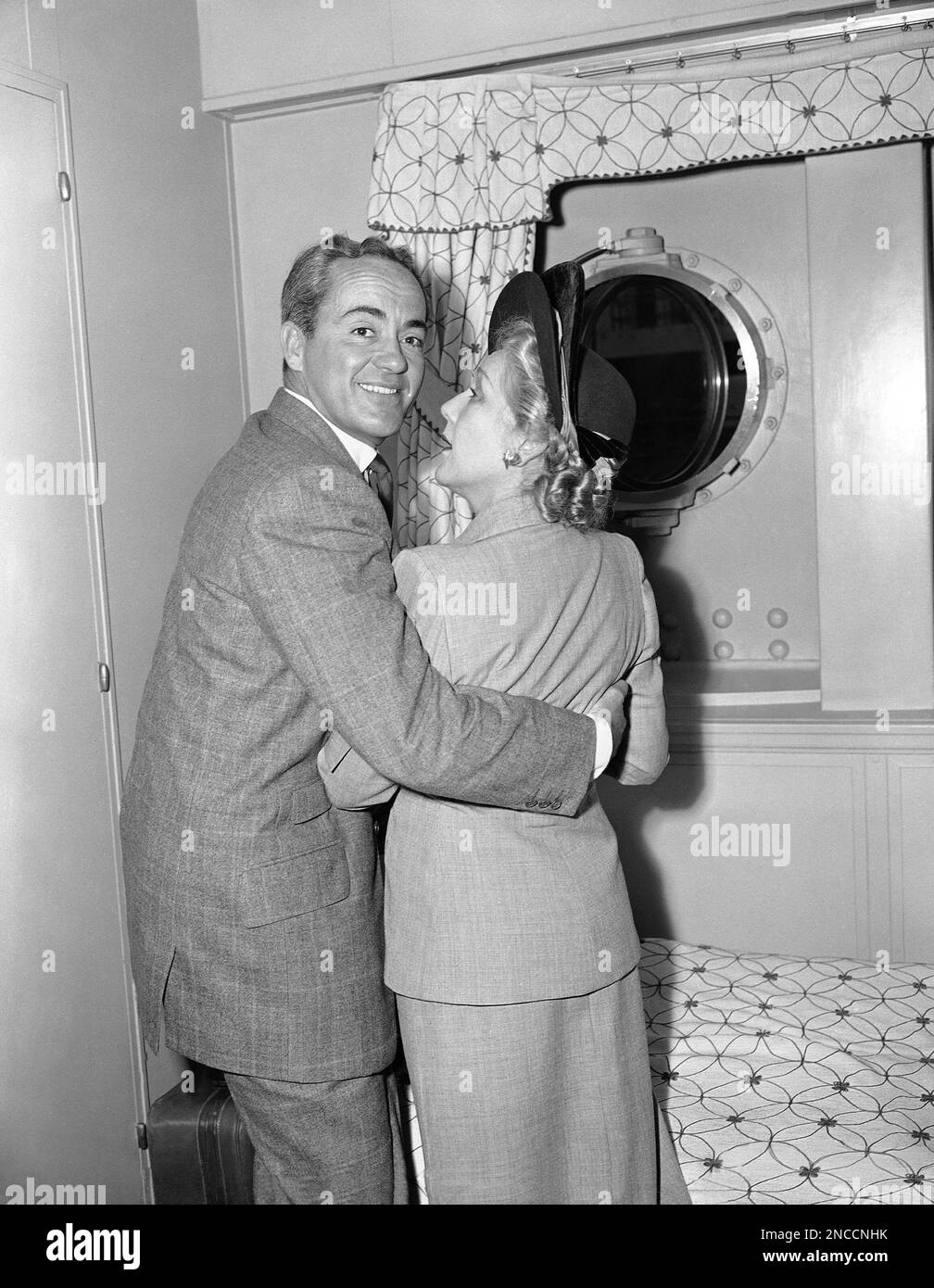 Mary Pickford and her husband, Charles (Buddy) Rogers, stand in their ...