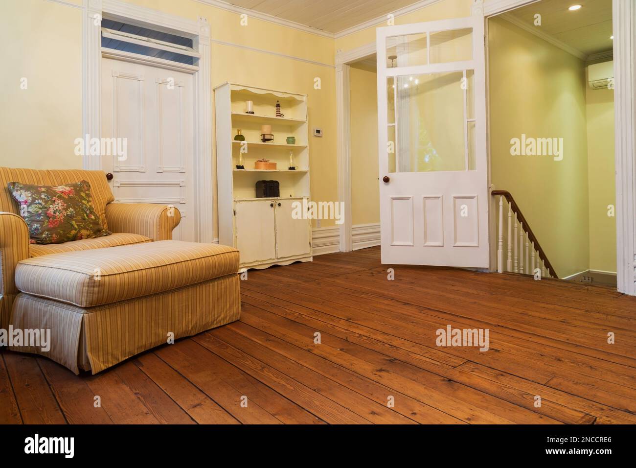 Countryman upholstered armchair with matching ottoman next to closed ...