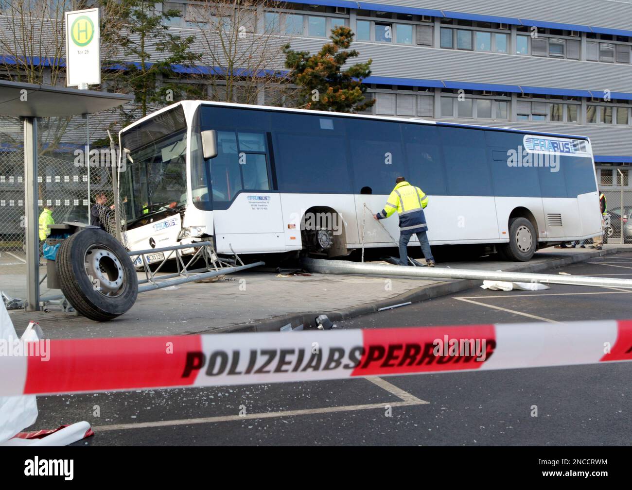 A damaged bus stands next to a bus stop at the airport of Frankfurt ...
