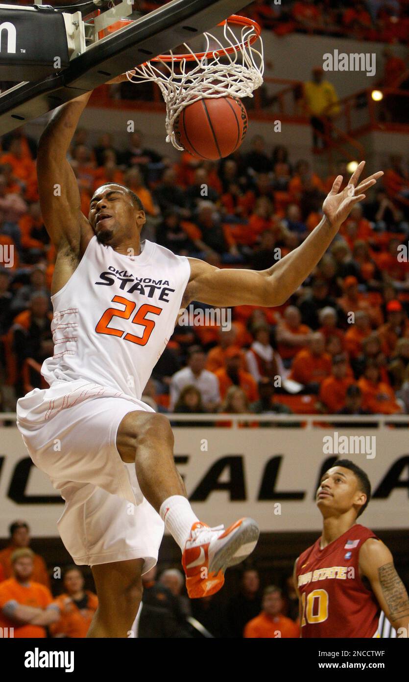 Oklahoma State's Darrell Williams, left, dunks in front of Iowa State ...