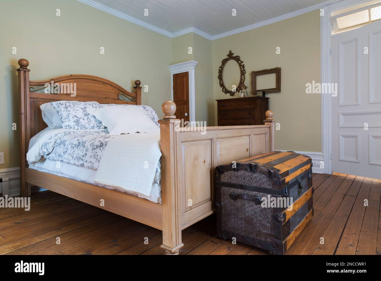 Queen size bed with wooden headboard and footboard, antique travel ...