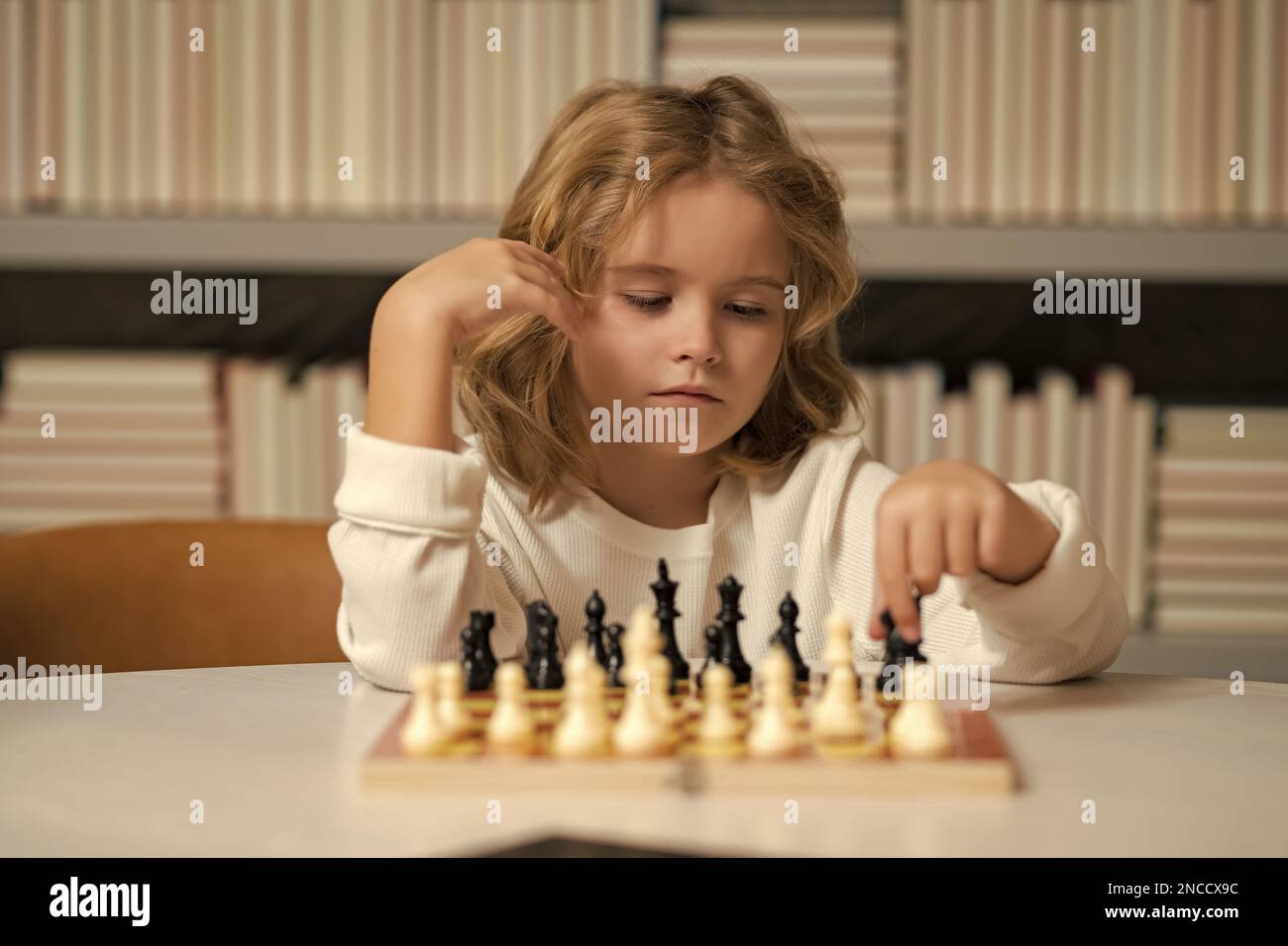 Early development. Boy thinking about chess. The concept of learning ...