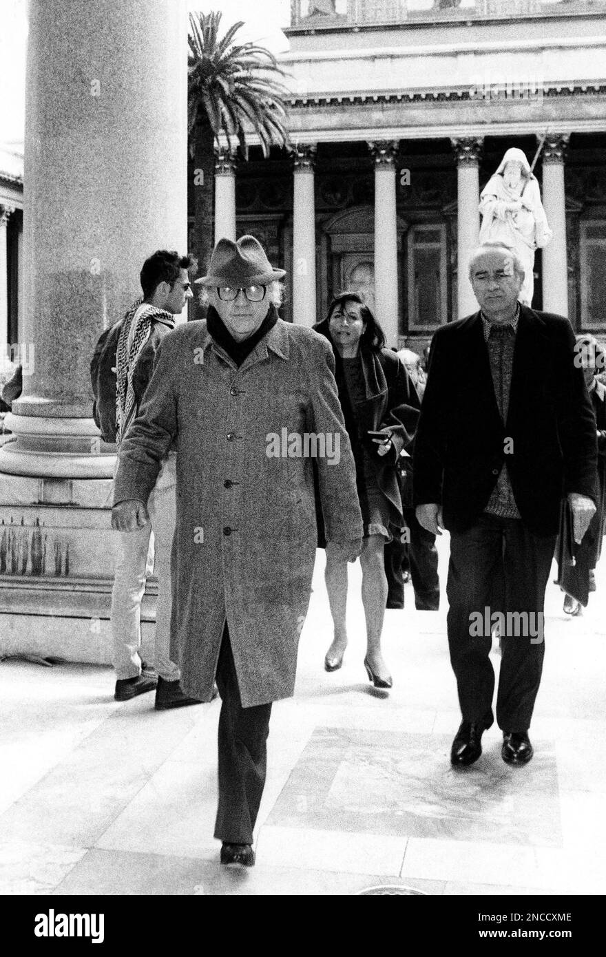 Italian film director Federico Fellini walks at the Basilica di San ...