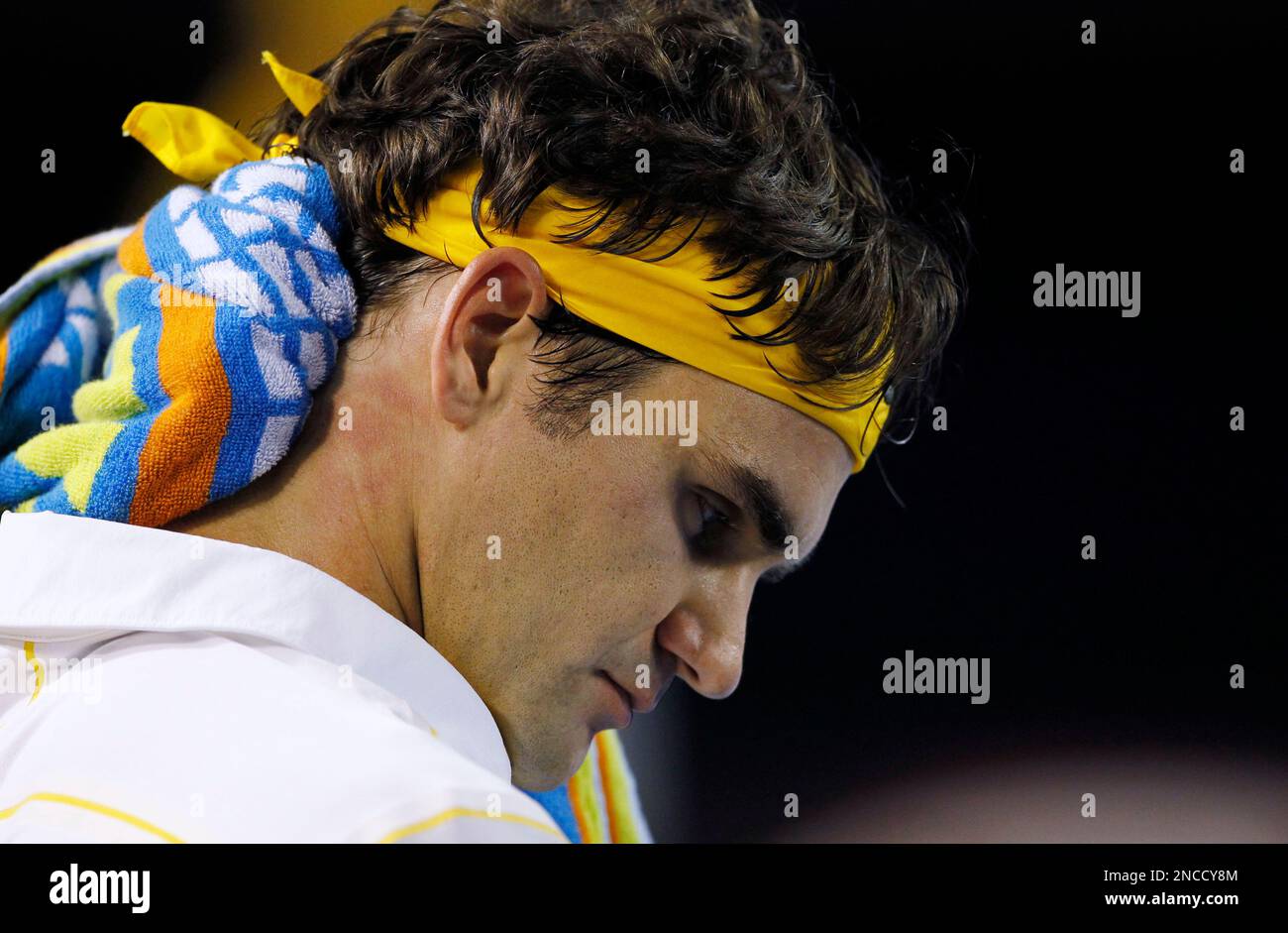 Switzerland's Roger Federer wipes the sweat from his head during his ...