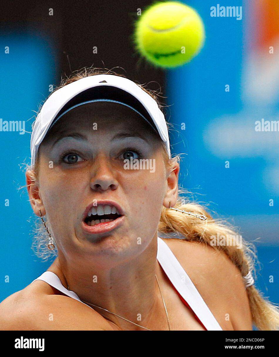 Caroline Wozniacki of Denmark eyes on the ball for a return to Vania ...