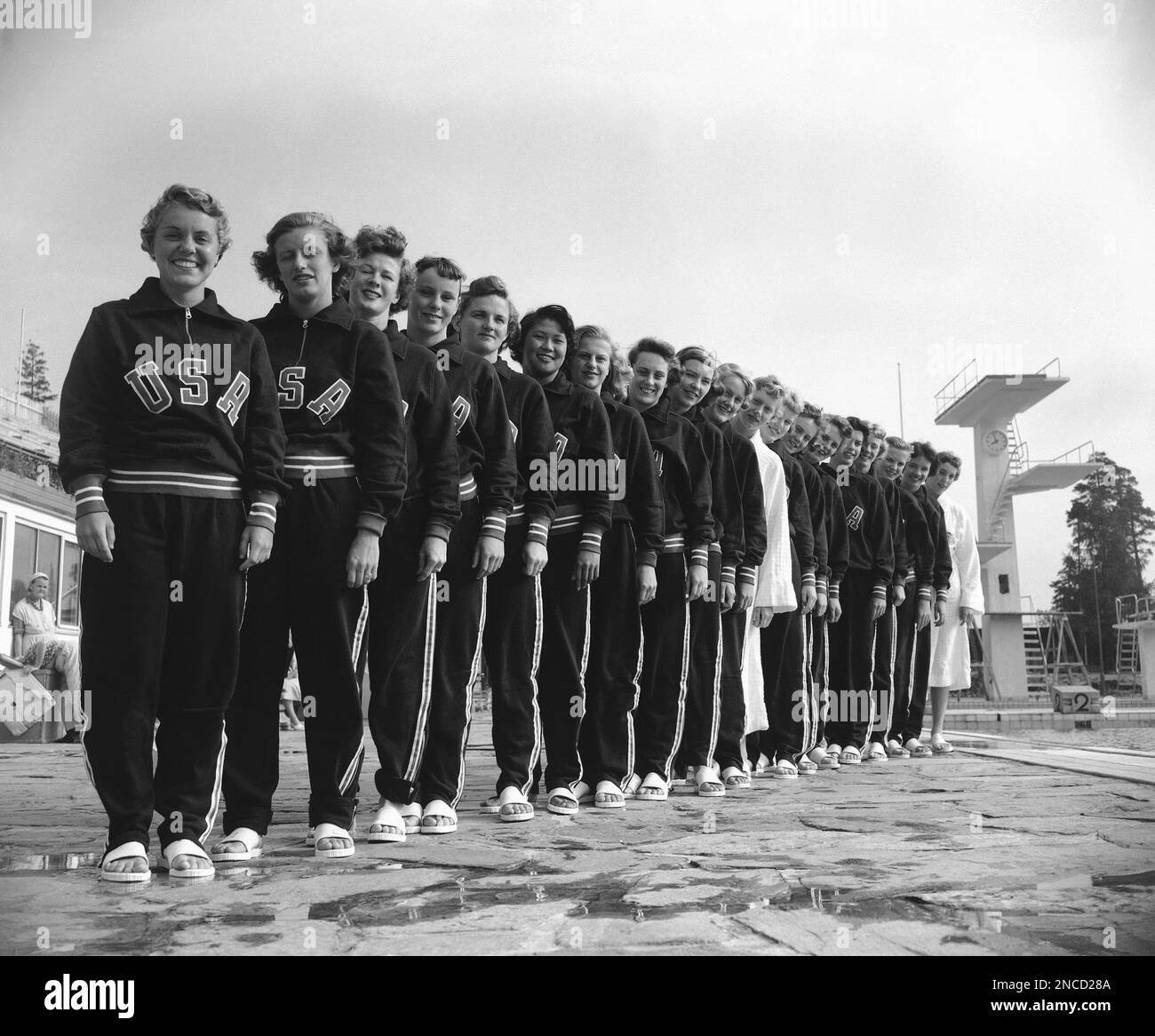 Members of U.S. Olympic diving and swimming team line up beside Olympic ...