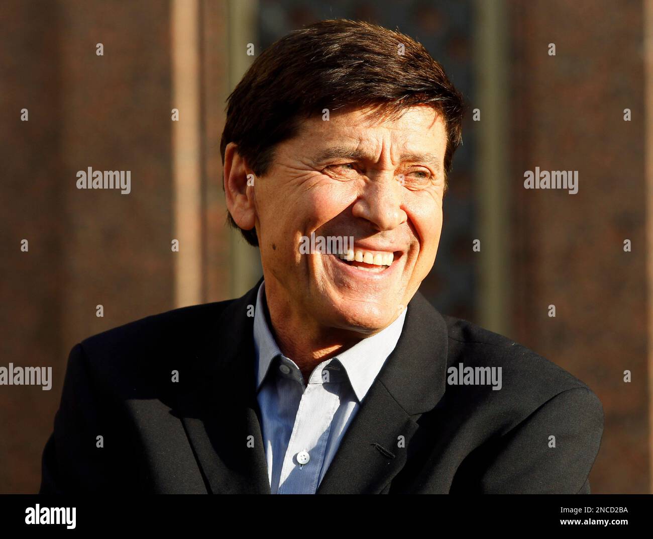 Italian singer Gianni Morandi looks on during the presentation of the ...