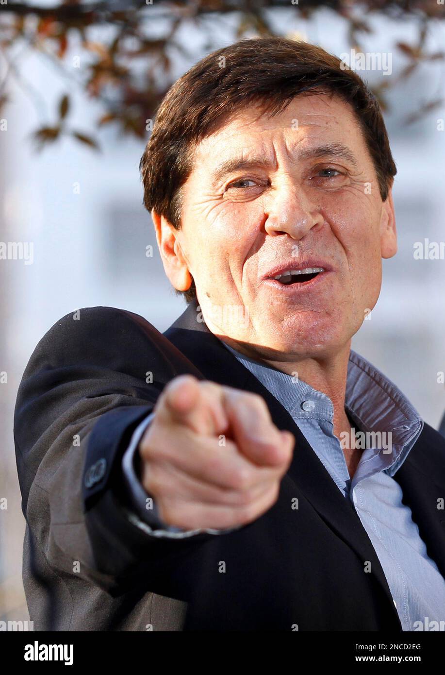 Italian singer Gianni Morandi poses for photos during the presentation ...