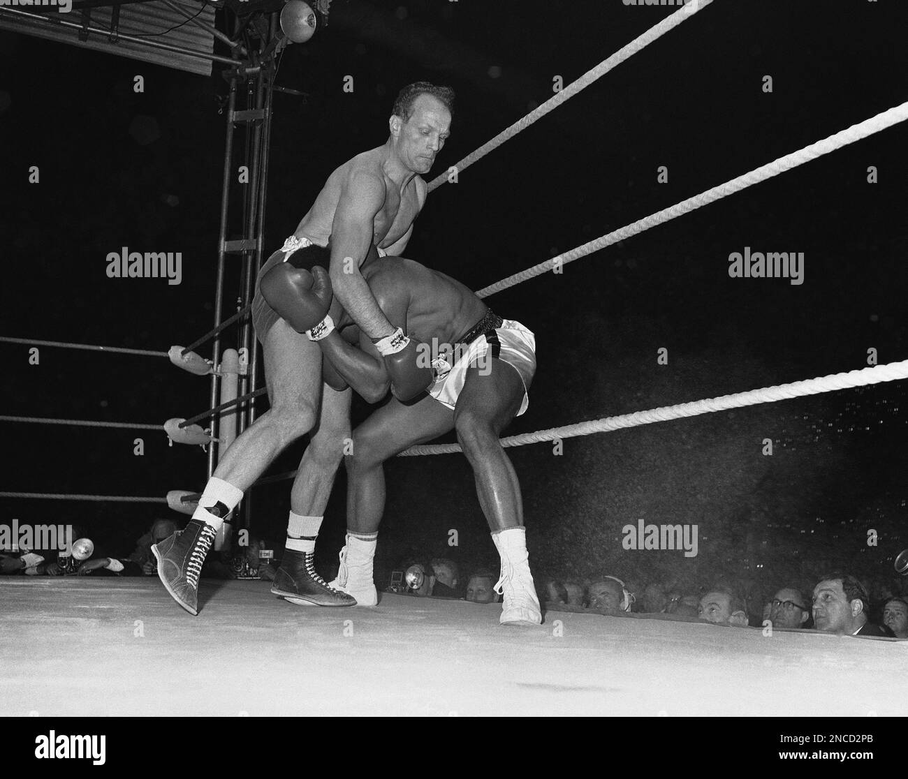 World Heavyweight Champion Cassius Clay, Muhammad Ali, ducks low from ...