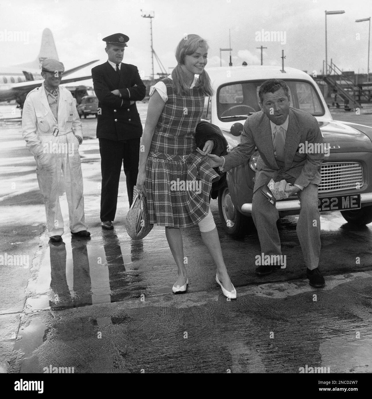 Actor Kenneth More displays bandage on leg of his co-star, Susannah ...