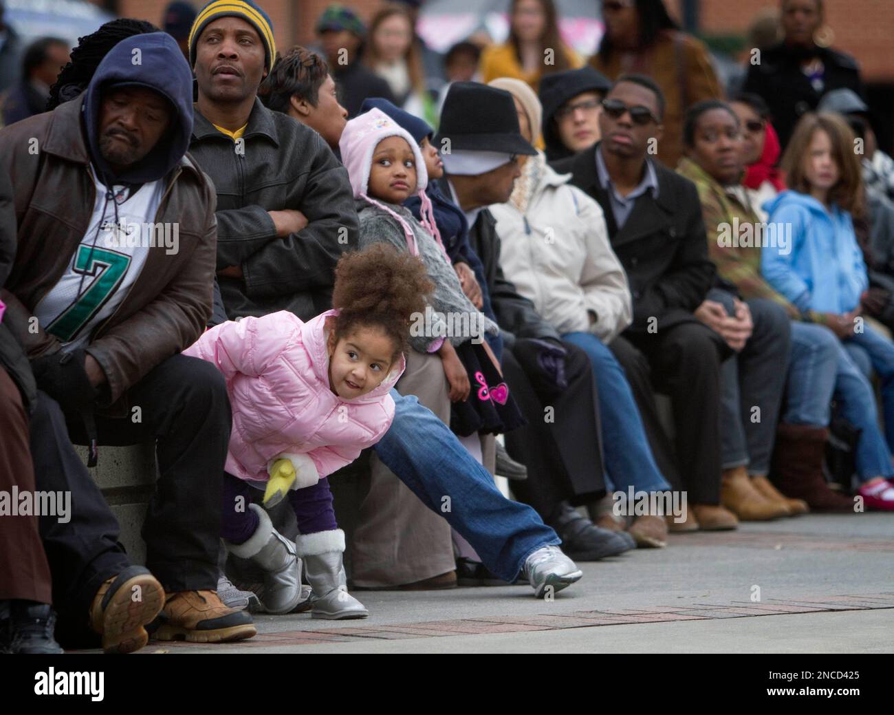 Skye-Amalia Durham, 3, of Atlanta, second from left, looks on at a big ...