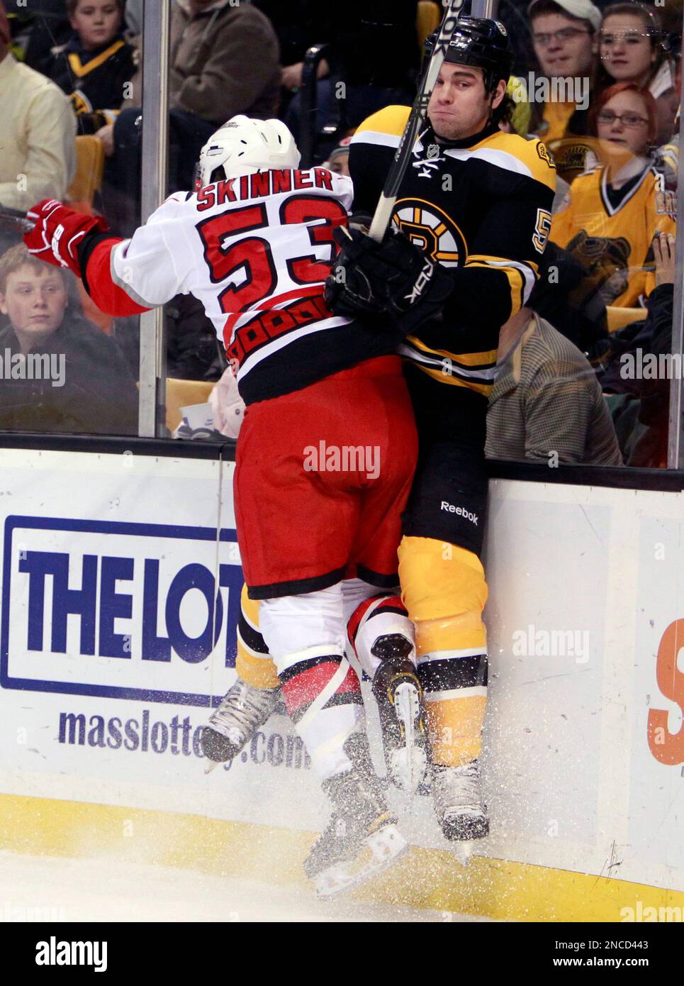 Carolina Hurricanes' Jeff Skinner (53) checks Boston Bruins' Adam ...