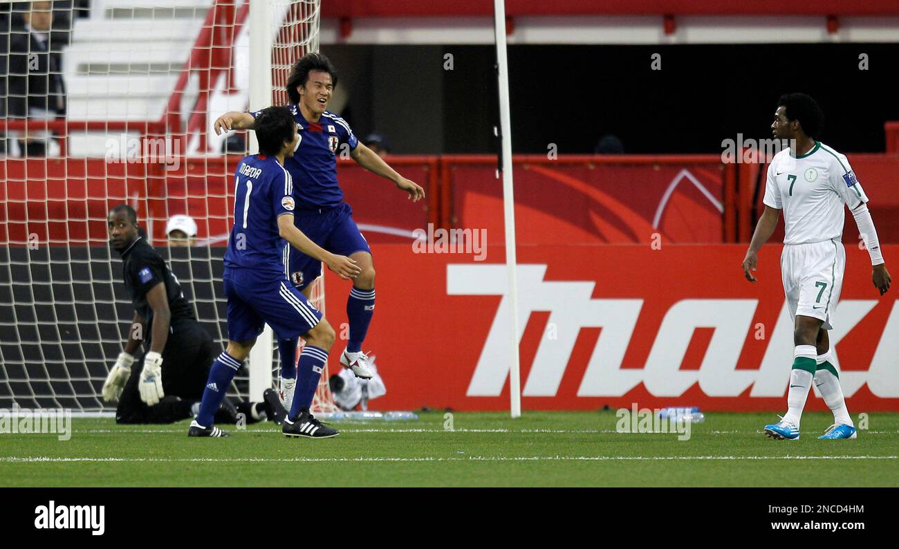 Japan's player Shinji Okazaki jumps up to celebrate with teammate ...