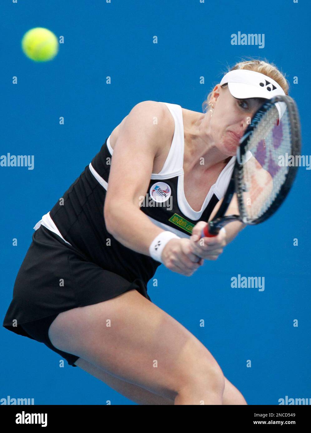 Elena Baltacha of Britain returns a ball to Jamie Hampton of the US ...
