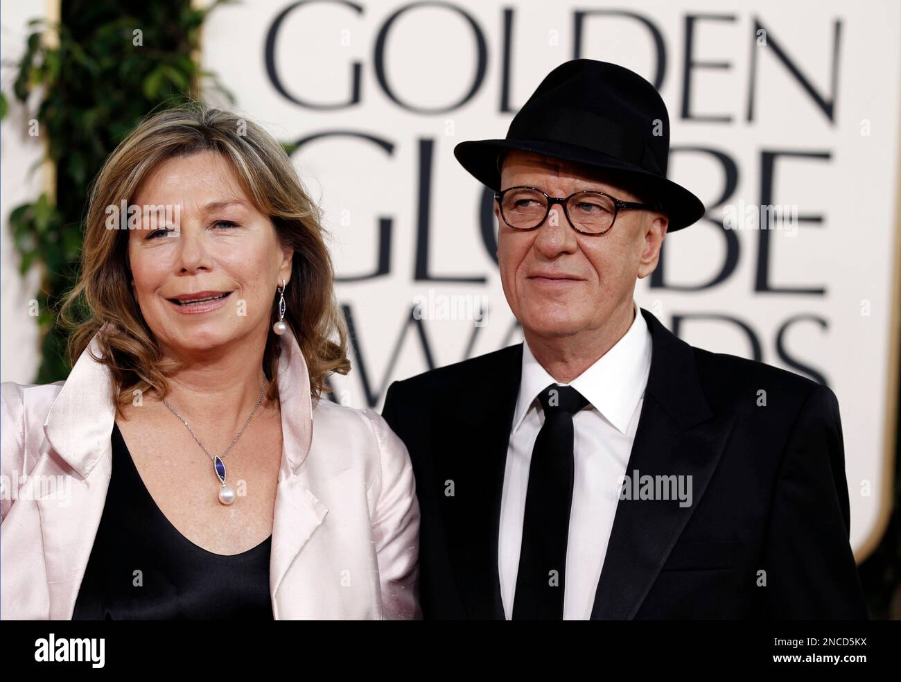 Geoffrey Rush and wife Jane Menelaus arrive before the Golden Globe ...