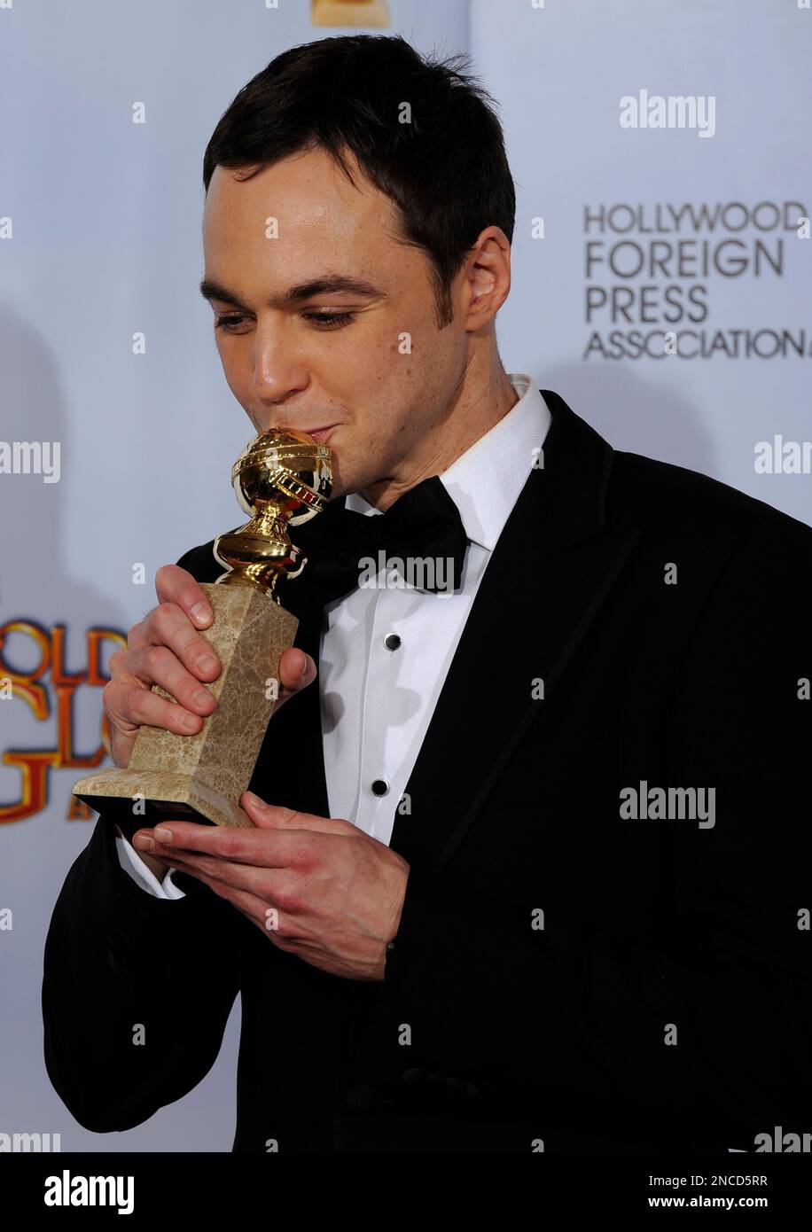Jim Parsons holds his award for Best Performance by an Actor in a ...