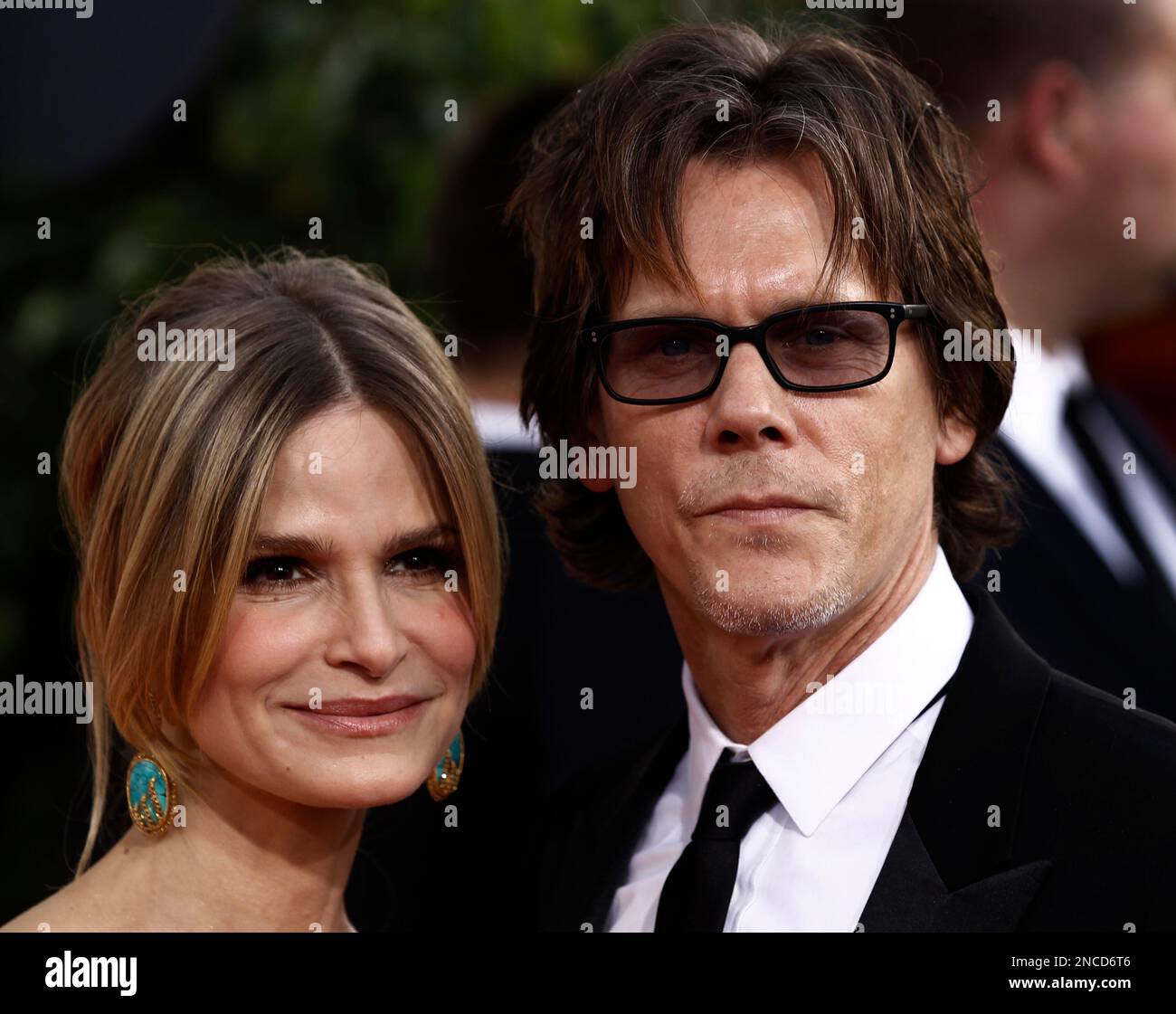 Kyra Sedgwick and her husband Kevin Bacon, right, arrive for the Golden ...