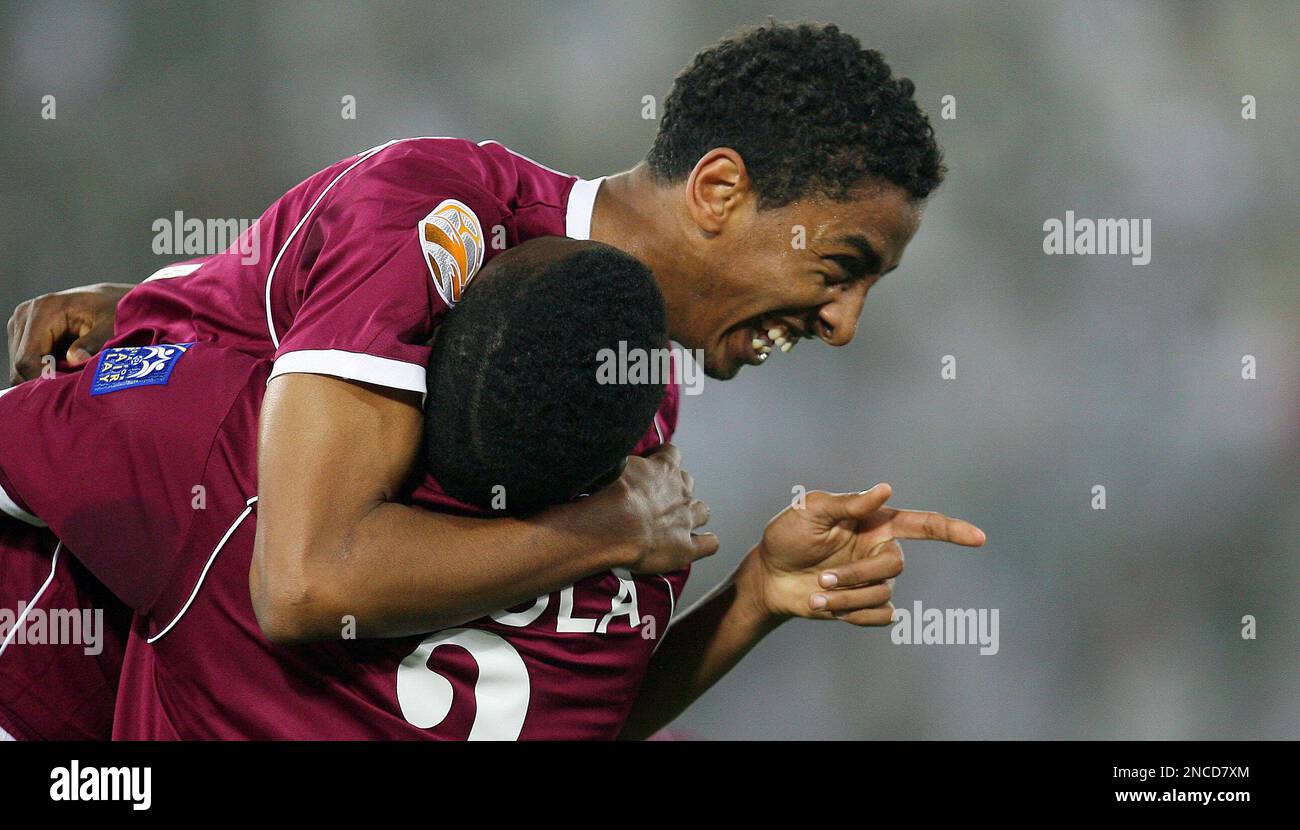 Qatar's Mohamed El Sayed, right, celebrates after scoring a goal ...