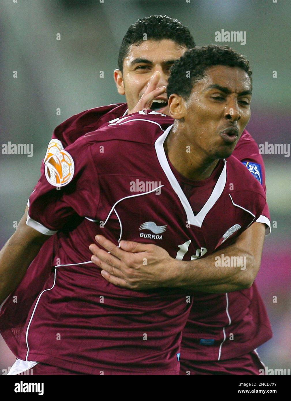Qatar's Mohamed El Sayed, front, celebrates after scoring a goal ...